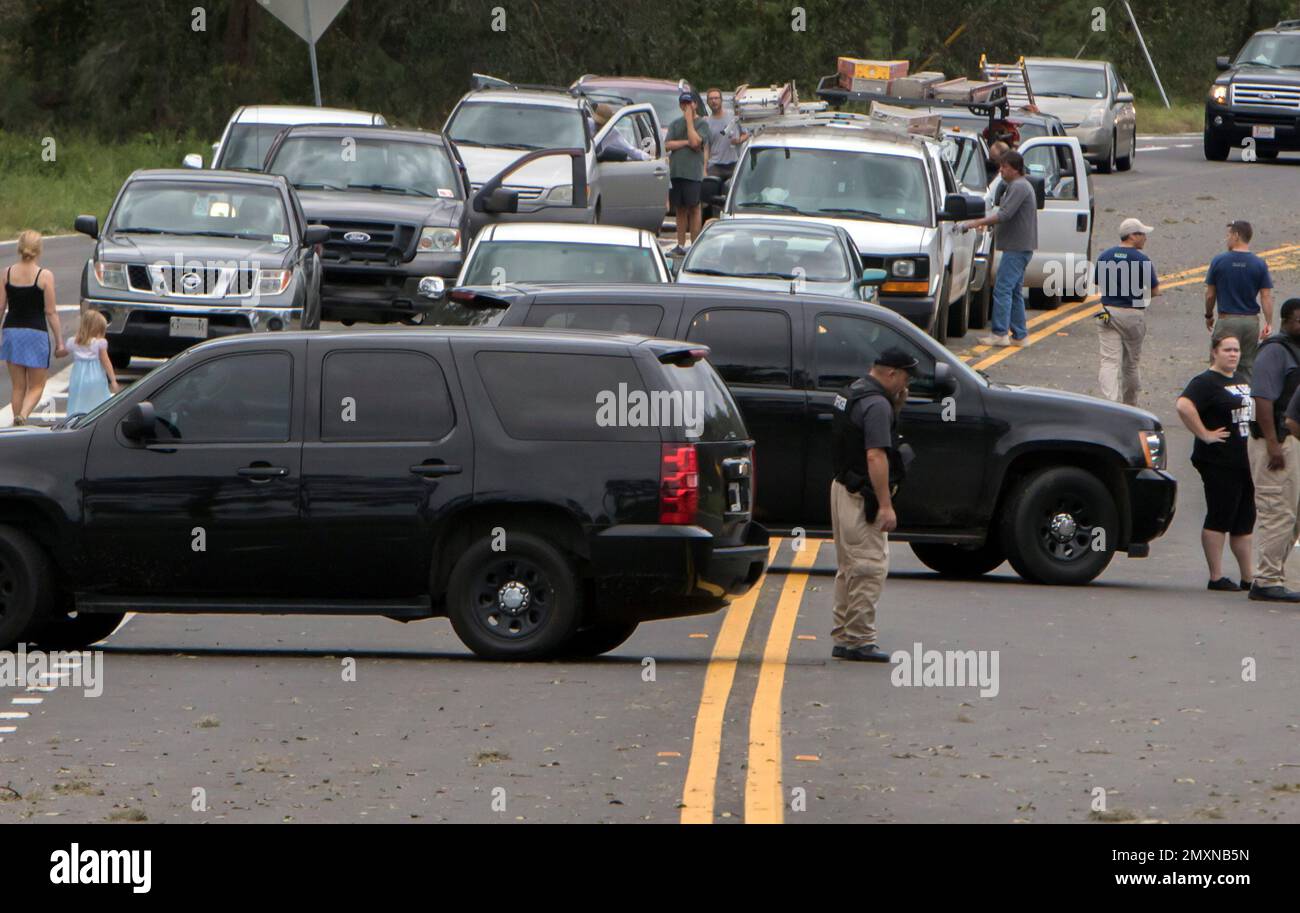 Police block the entrance to the Bull River Bridge at the causeway to ...