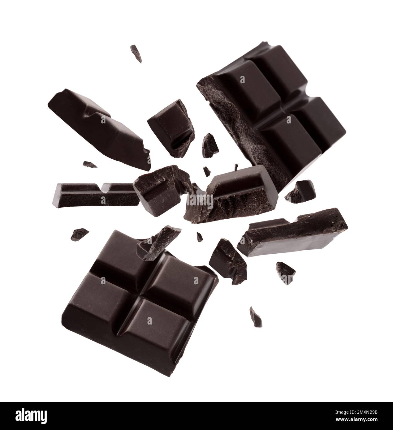 Dark chocolate explosion, pieces shattering on white background Stock ...