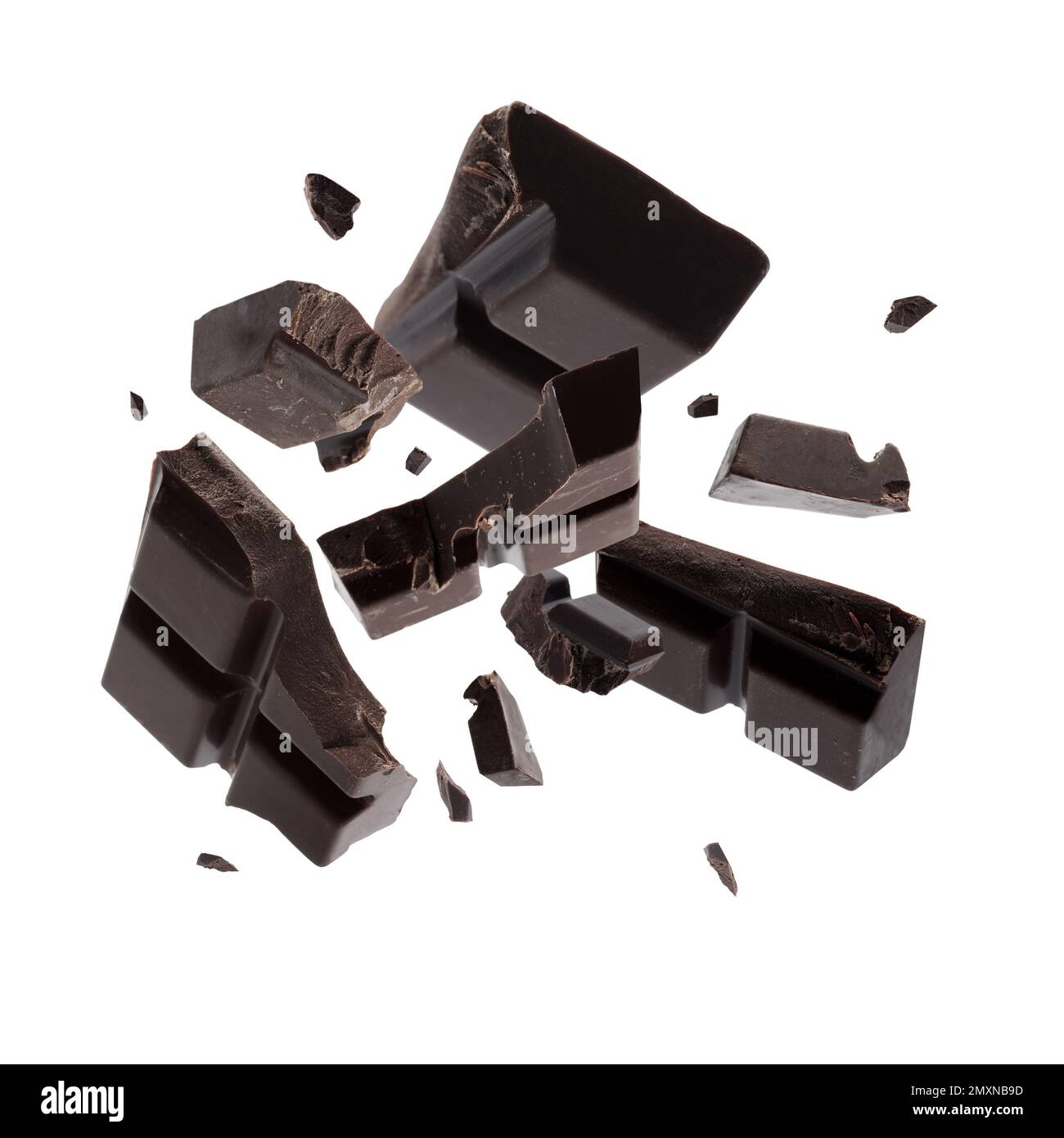 Dark chocolate explosion, pieces shattering on white background Stock ...