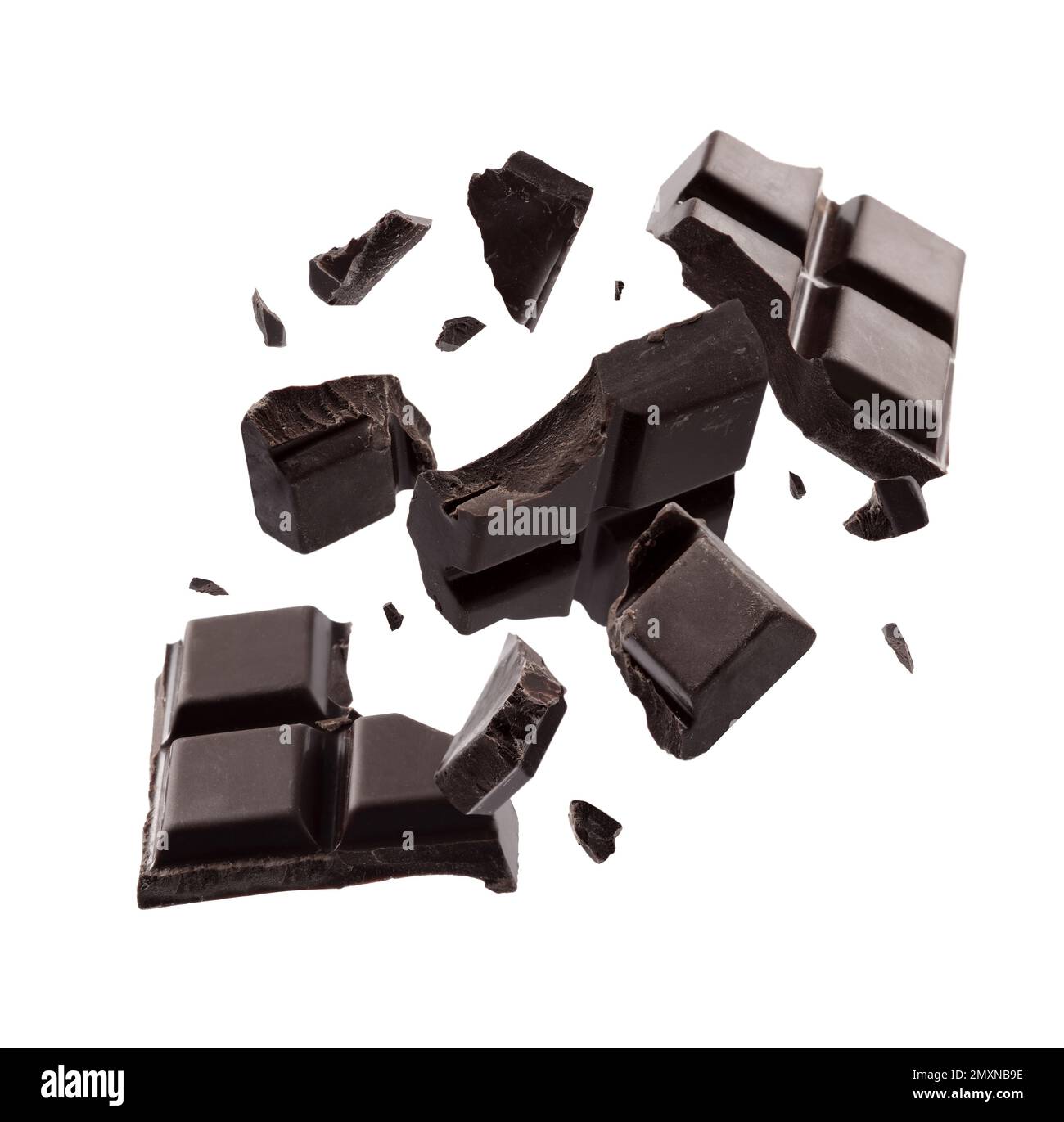 Dark chocolate explosion, pieces shattering on white background Stock ...