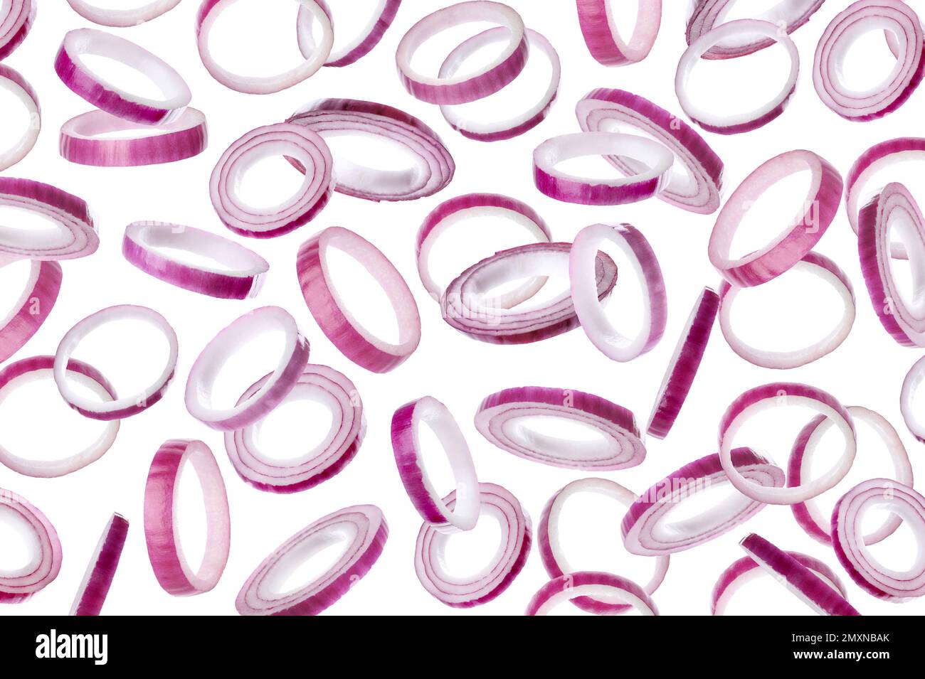 Red onion slices flying on white background Stock Photo - Alamy