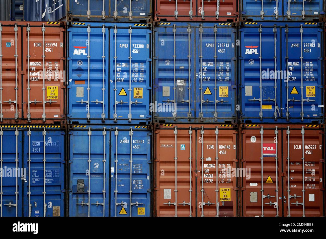 Shipping containers are stacked in the port in Hamburg, Germany, Sunday ...