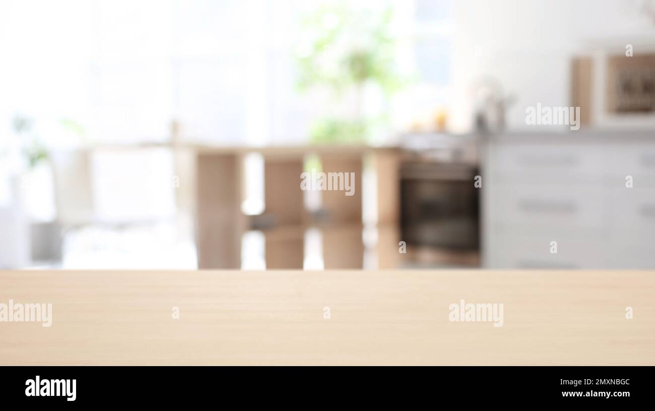 Wooden desk and blurred room on background. Home furniture Stock Photo ...