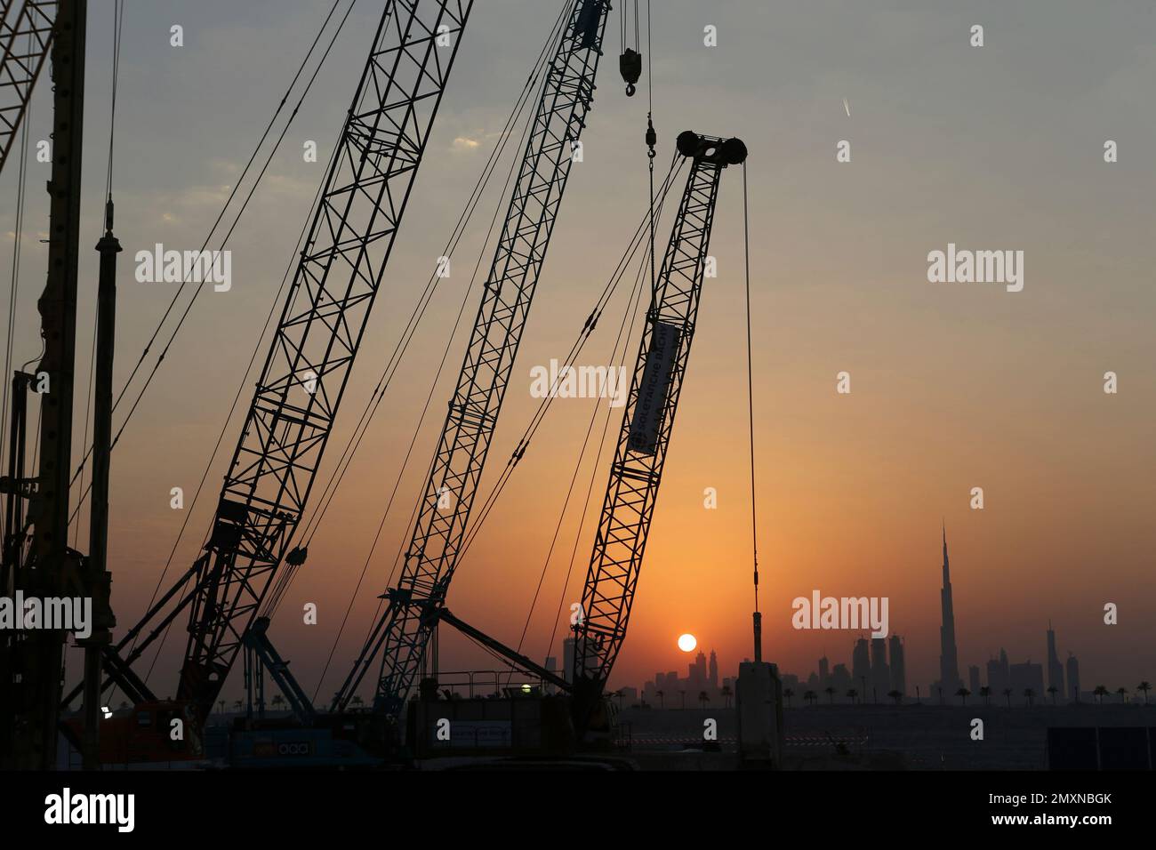 Construction cranes line the Dubai Creek Harbour construction site ...