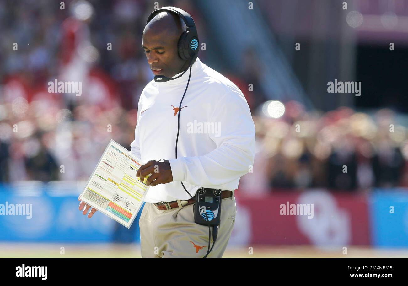 Texas head coach Charlie Strong walks the sidelines during the first ...