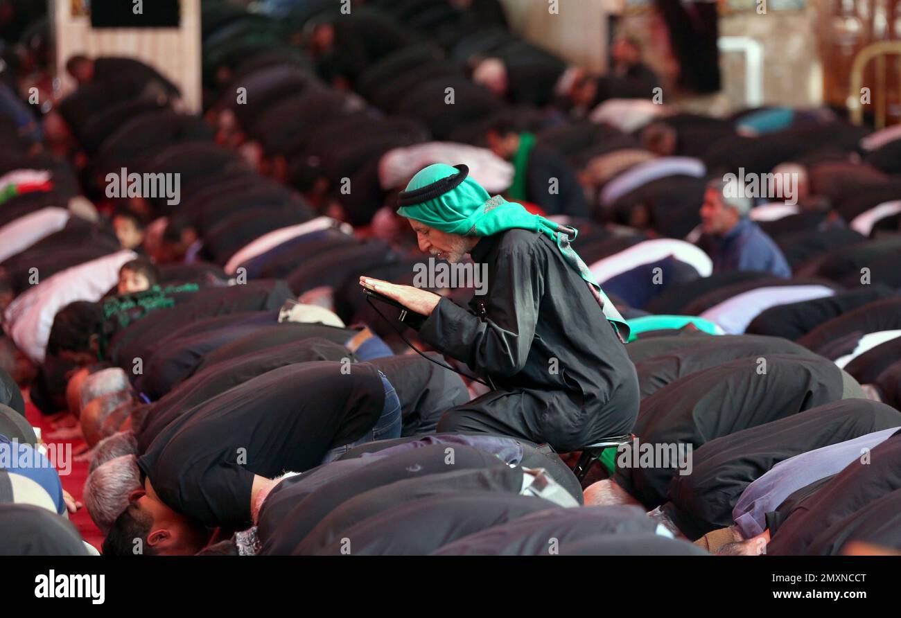Shiite worshippers pray inside the shrine of Imam Abbas during Muharram ...