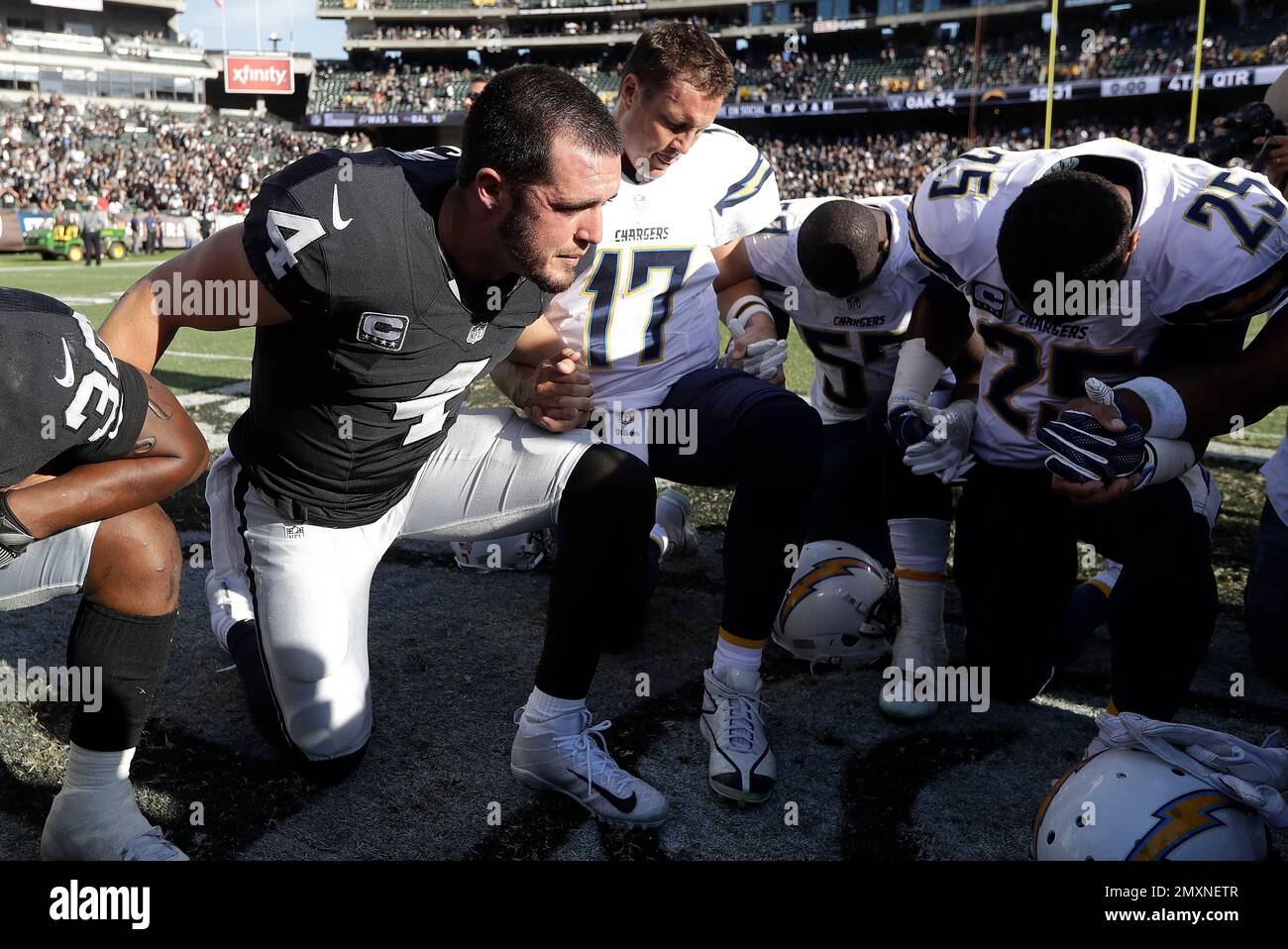 Oakland Raiders quarterback Derek Carr (4) and San Diego Chargers ...