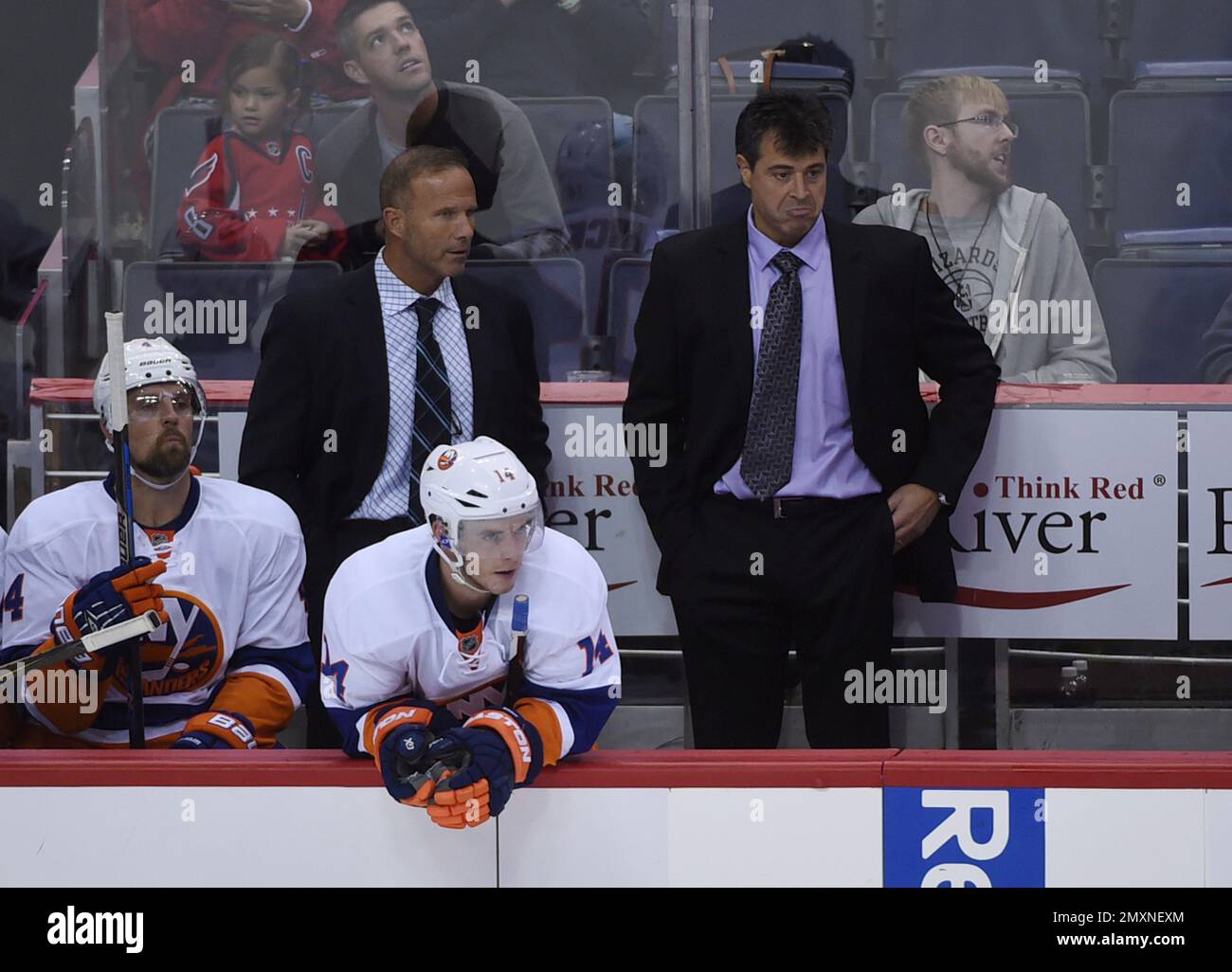 New York Islanders coach Jack Capuano, right, watches play against the ...