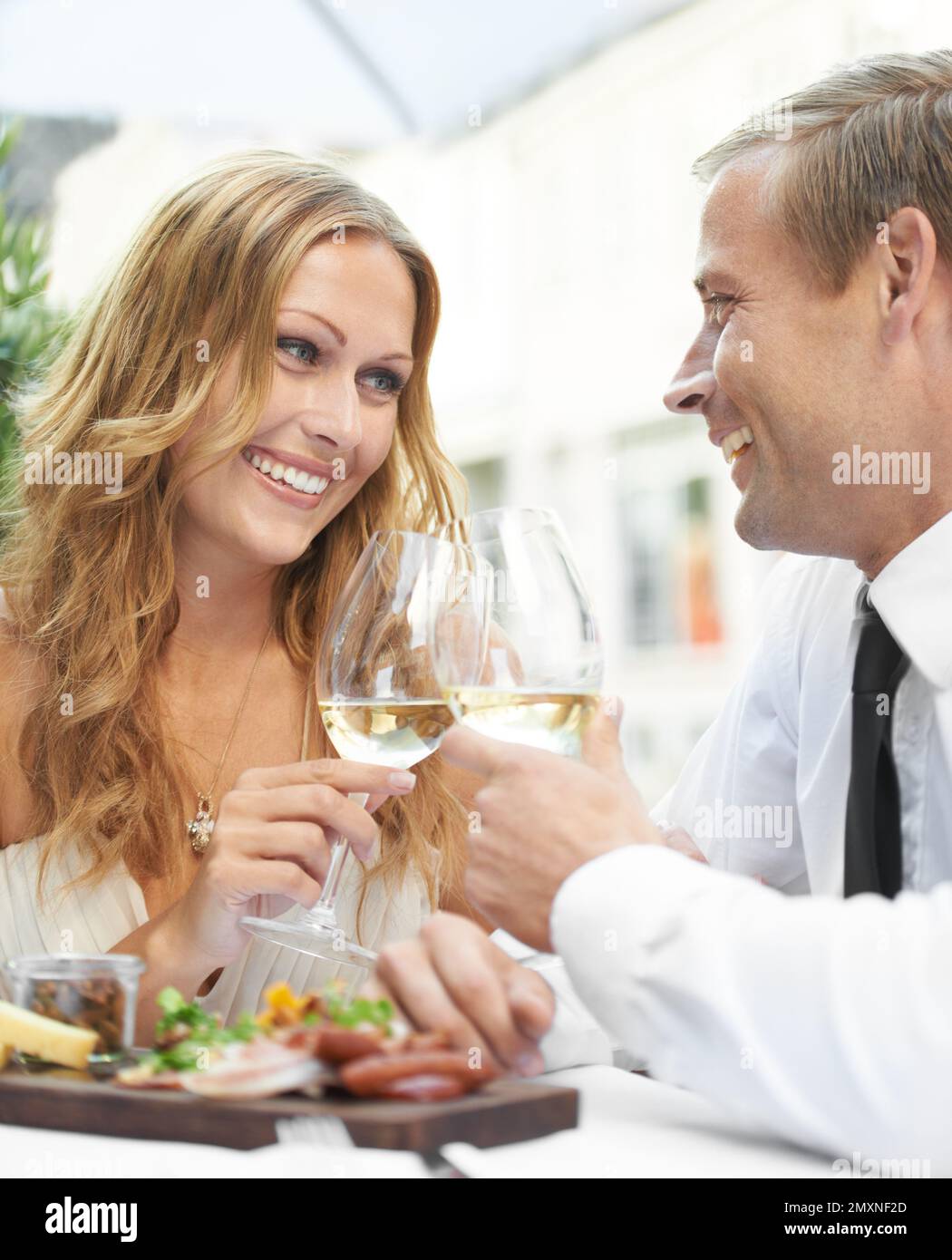 Happy, toast and wine with couple at restaurant for food, valentines ...