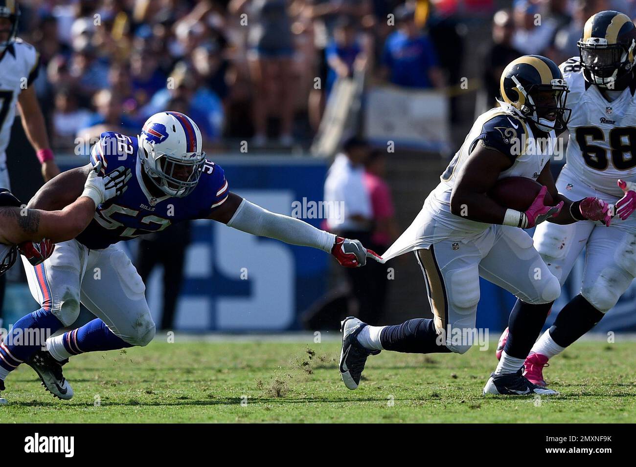 Buffalo Bills inside linebacker Preston Brown, left, gets a finger on ...