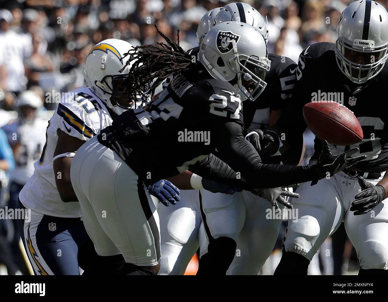 Oakland Raiders free safety Reggie Nelson (27) grabs a fumble by San ...