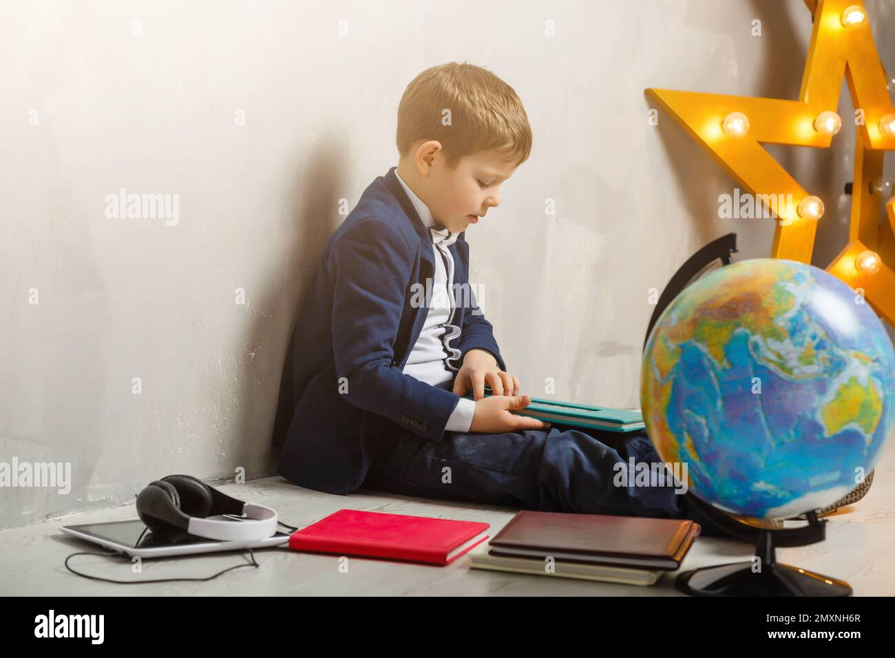 Happy curious kid little boy genius on gray background Stock Photo - Alamy