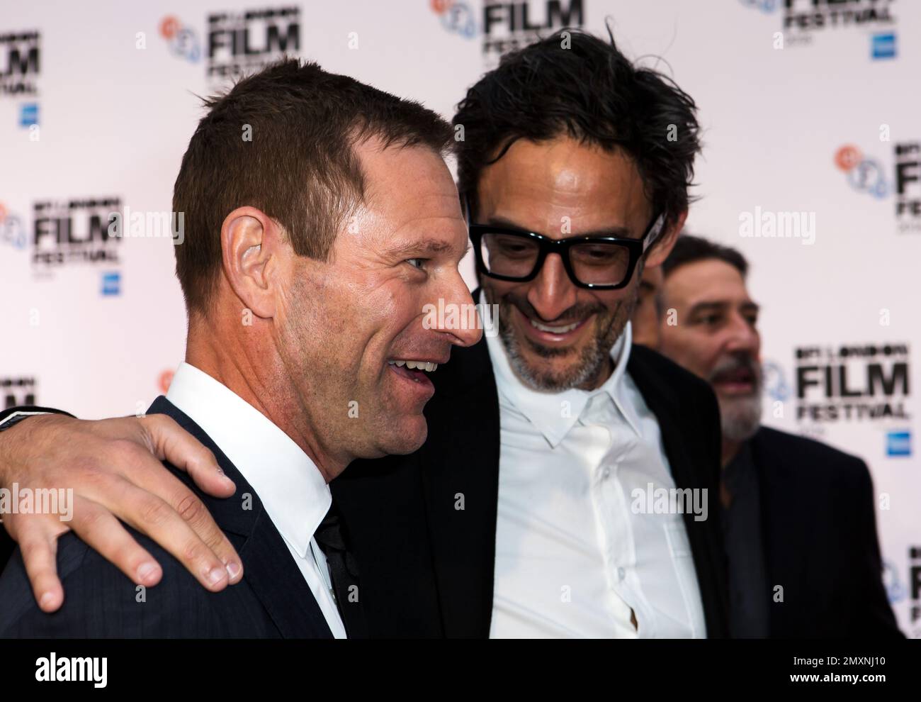 Actor Aaron Eckhart , left, jokes with director Ben Young as they pose ...