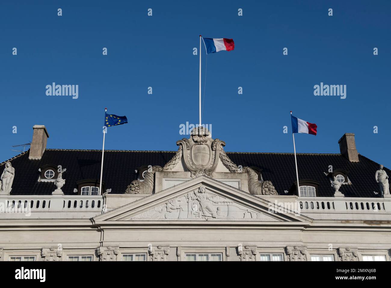French and EU flags over tympanum, French Embassy, Copenhagen, Denmark ...