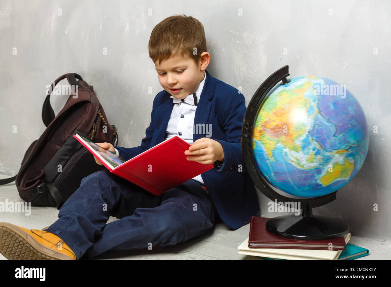 little student holding books, self-education Stock Photo - Alamy