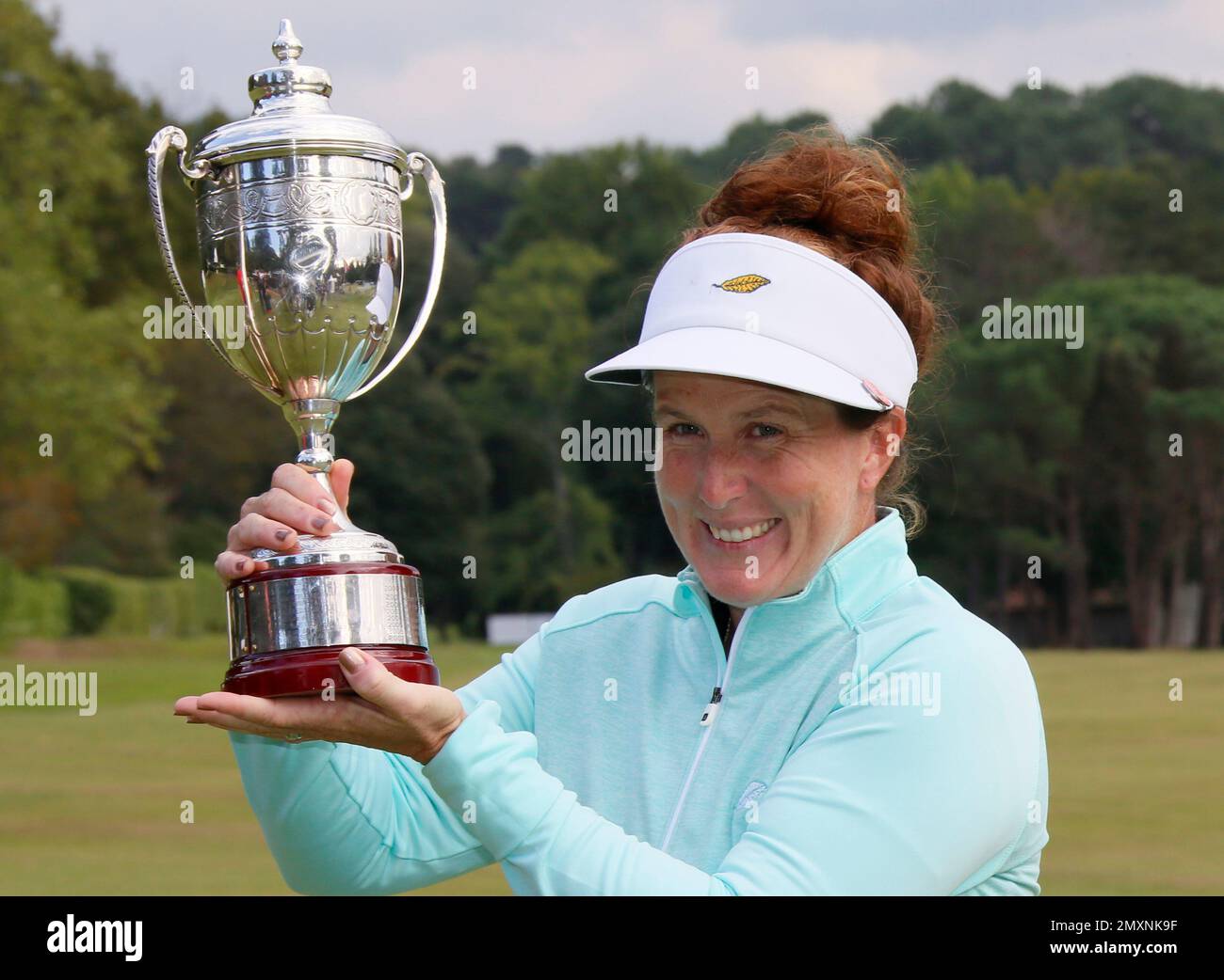 Beth Allen of U.S holds her trophy as she poses for photographers after ...