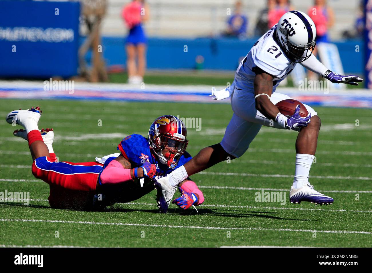 TCU running back Kyle Hicks (21) breaks away from Kansas safety Fish ...