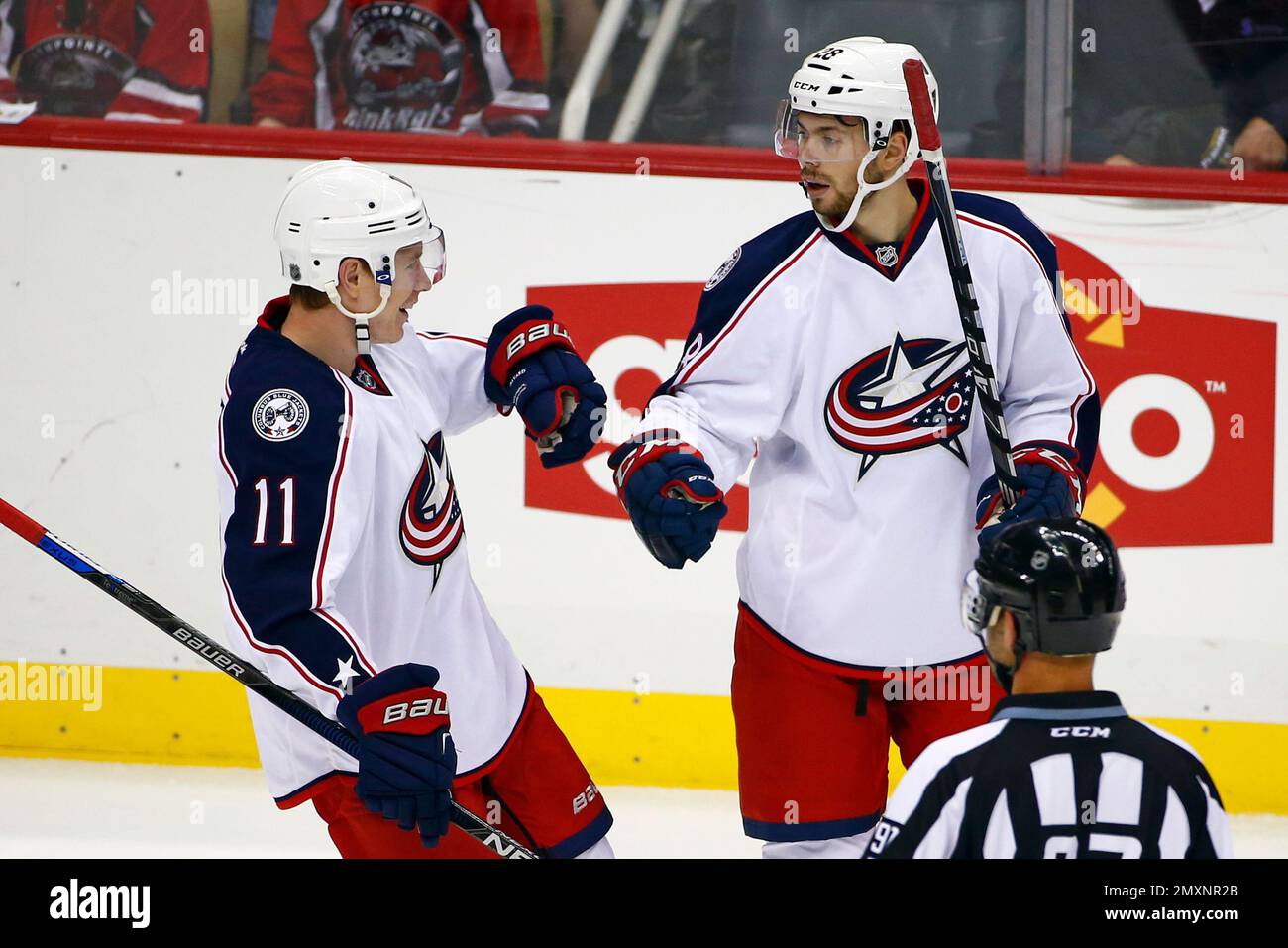 Columbus Blue Jackets' Oliver Bjorkstrand, right, celebrates his goal ...