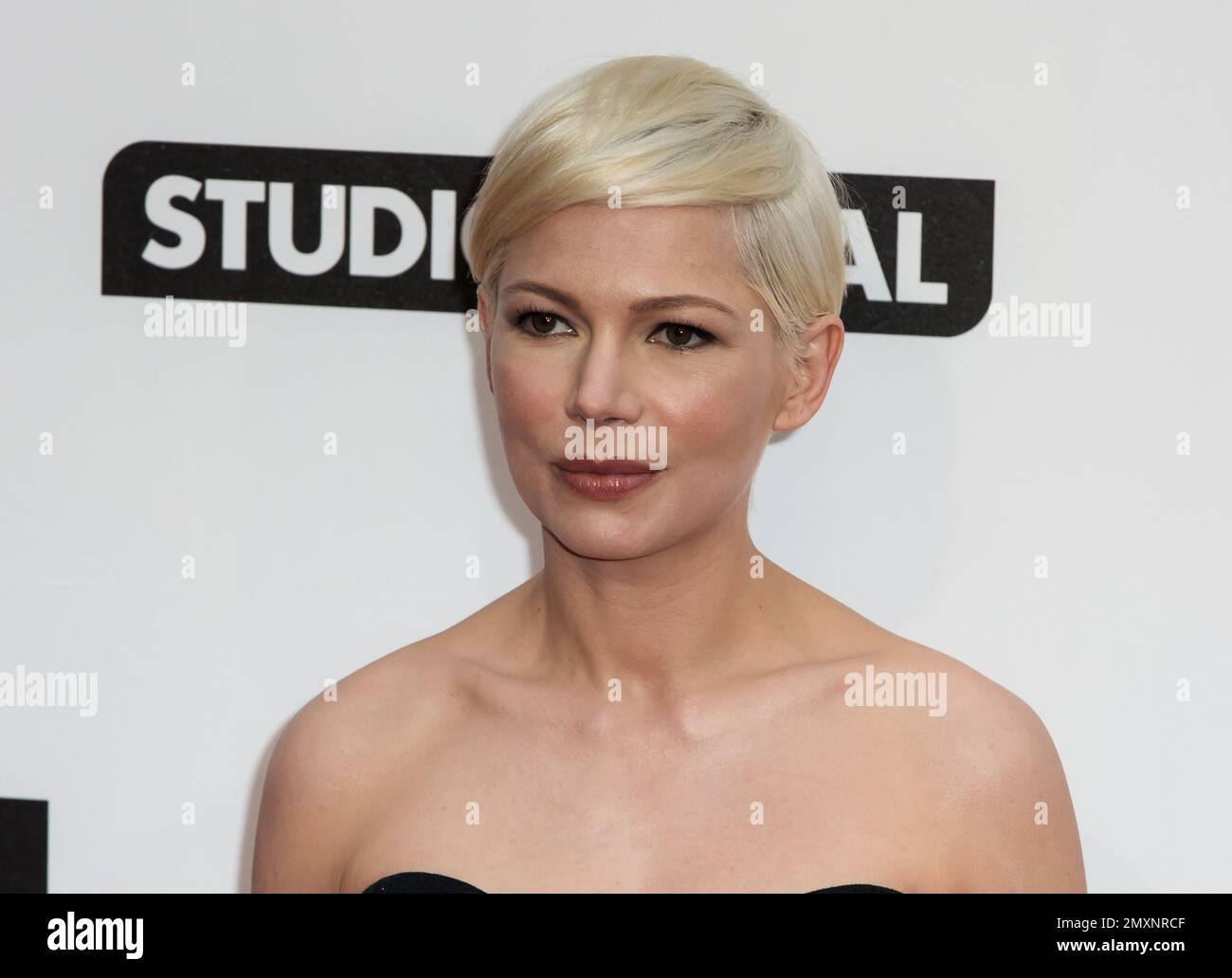 Actress Michelle Williams poses for photographers on arrival at the ...