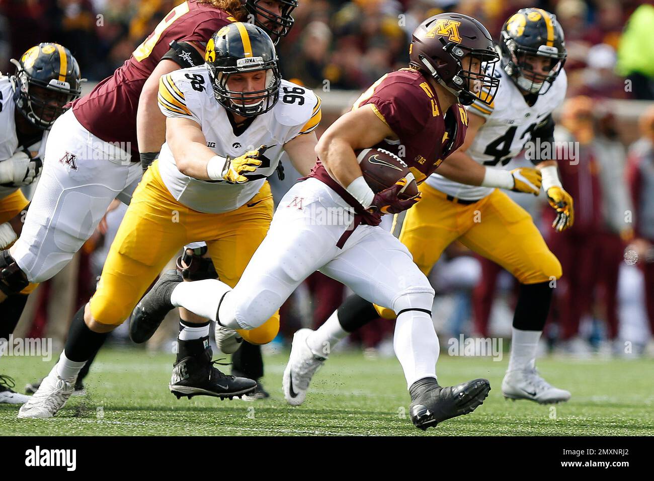 Minnesota running back Shannon Brooks (23) runs out of reach of Iowa ...