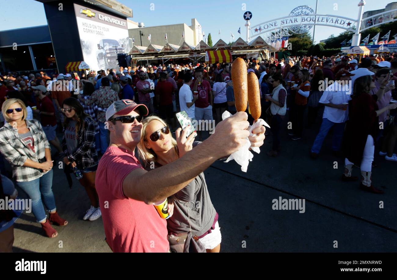 Gwin Huey, right, and her husband Ryan Huey make a photo of their corn ...