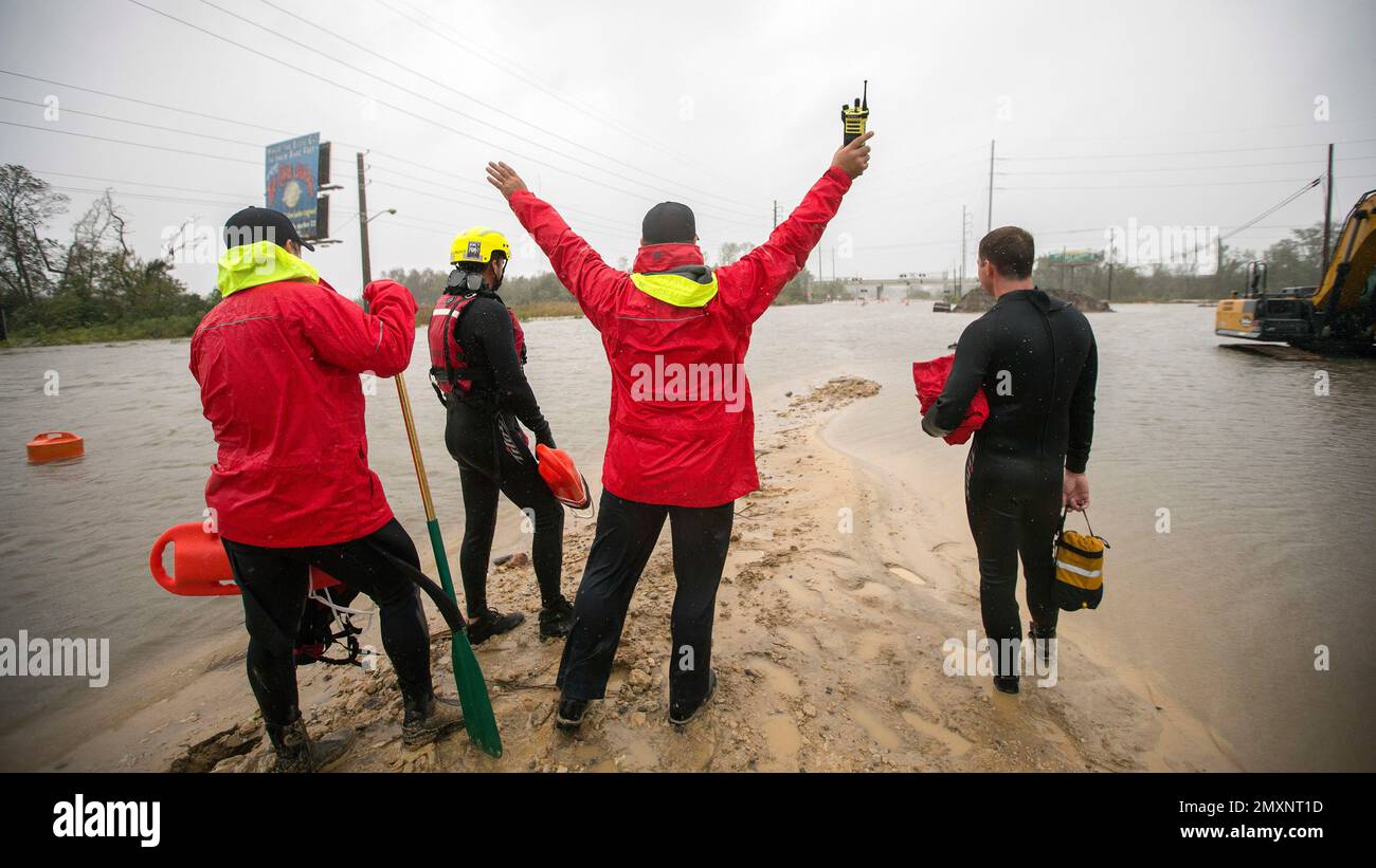 Members of Savannah Fire Rescue signal a vehicle floating on flooded ...