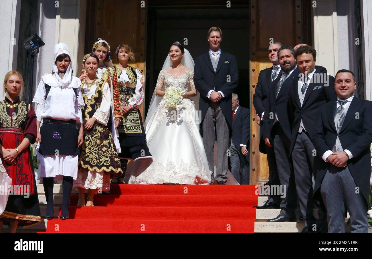 Albania's Crown Prince Leka II and his wife Elia Zaharia walk after ...