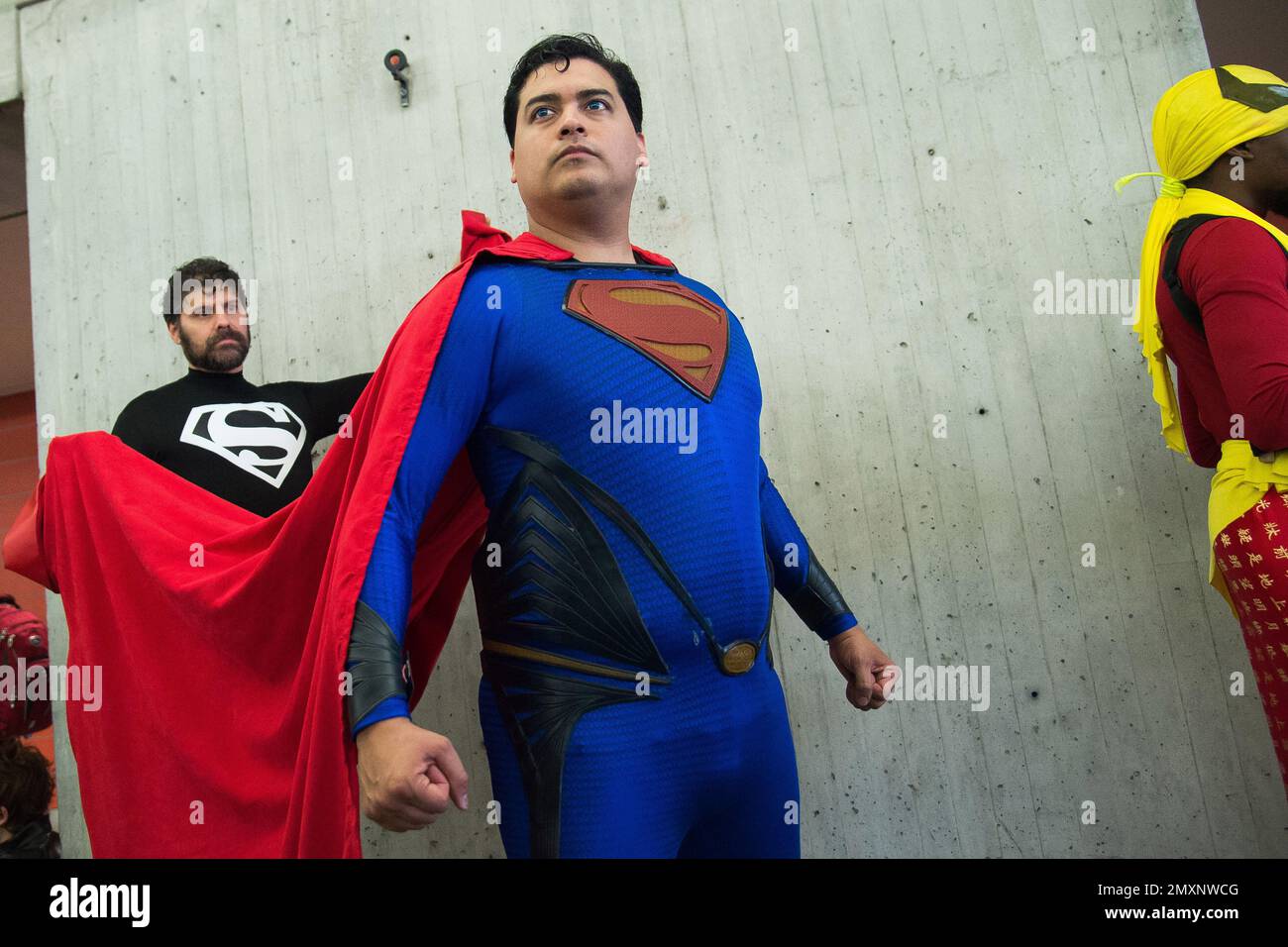 An attendee dressed as Superman strikes a pose at New York Comic Con at ...