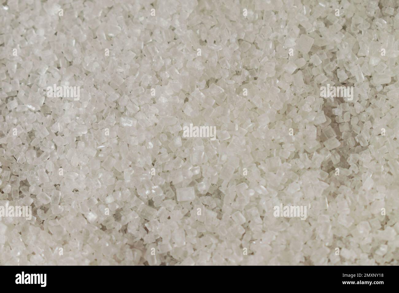 A top view texture background full of white refined sugar crystals ...