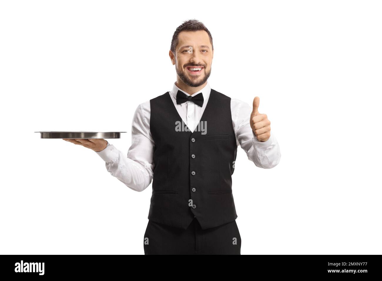 Portrait of a waiter holding a silver tray and showing thumbs up ...