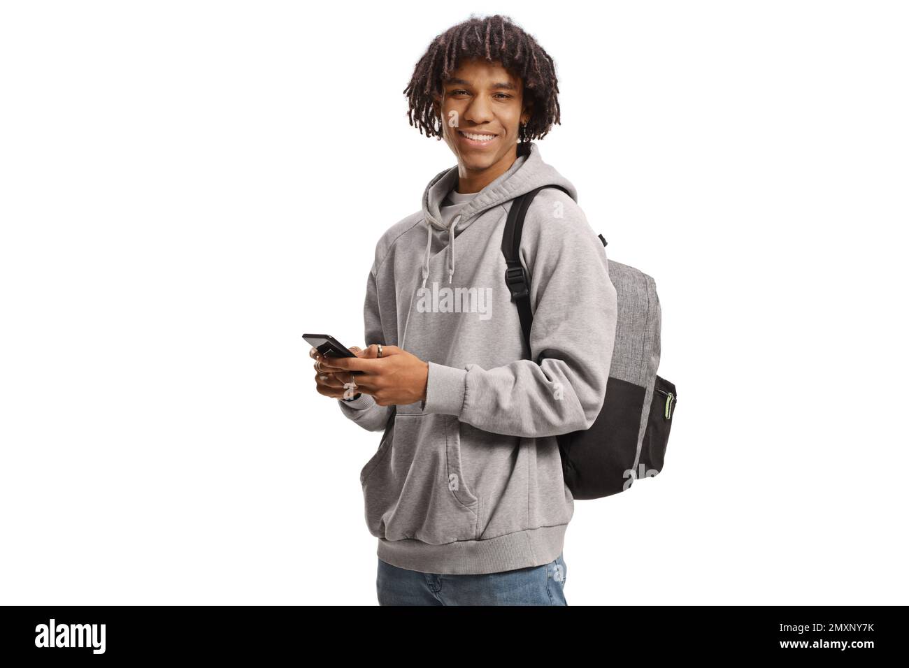Young african american male student using a smartphone and smiling ...