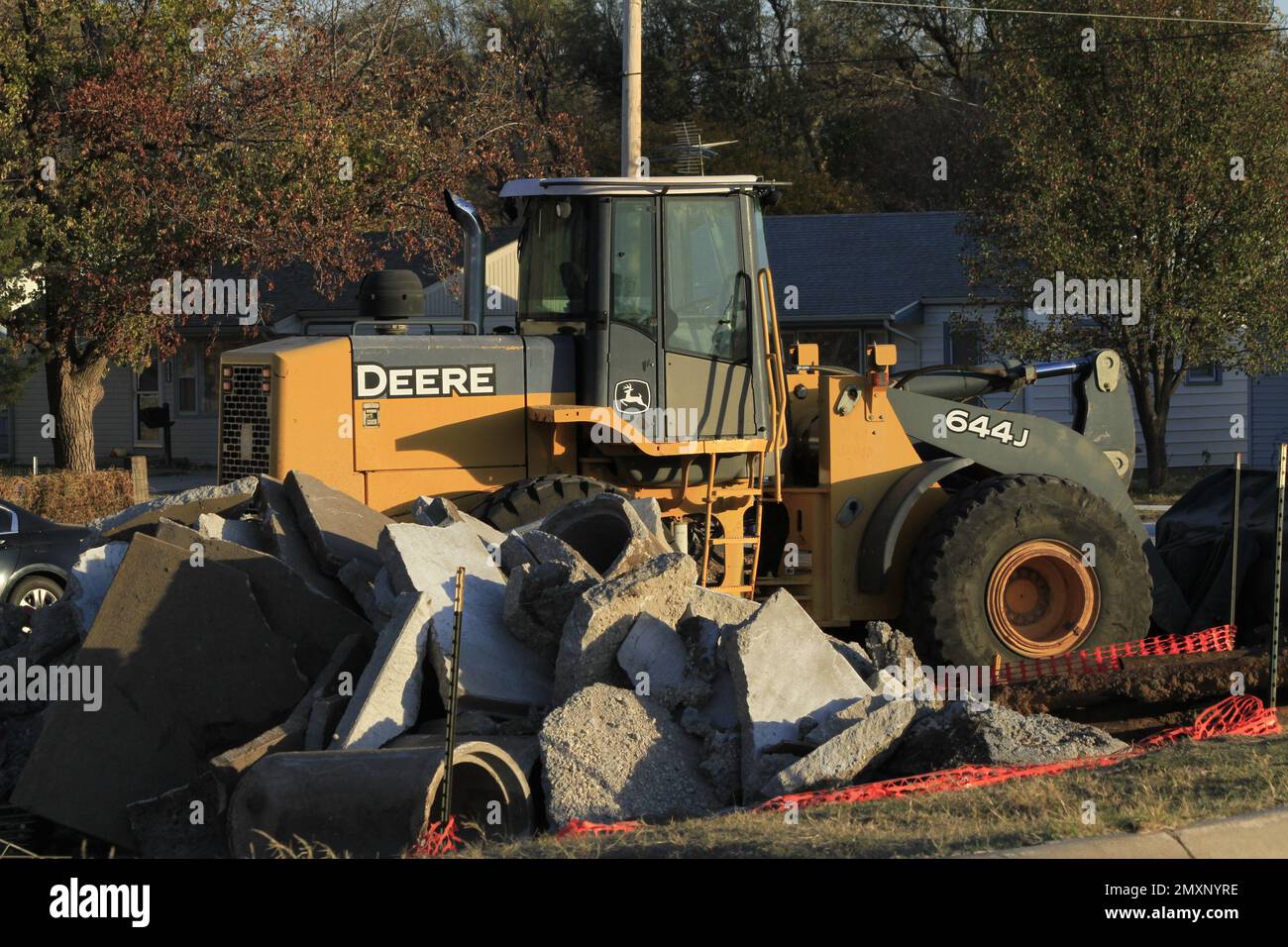 A John Deere Wheel Loader at a work site with trees Stock Photo - Alamy
