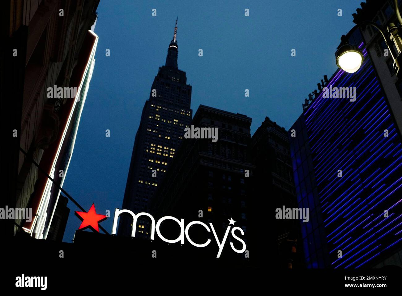 A Macy's sign is illuminated on a store marquis, Sept. 17, 2016 in New ...