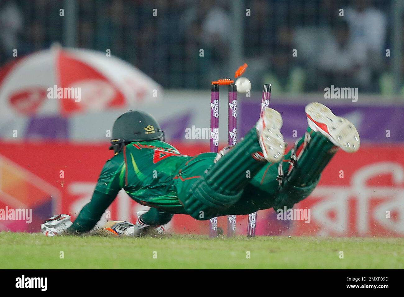 Bangladesh’s Imrul Kayes drives to make his ground successfully during ...
