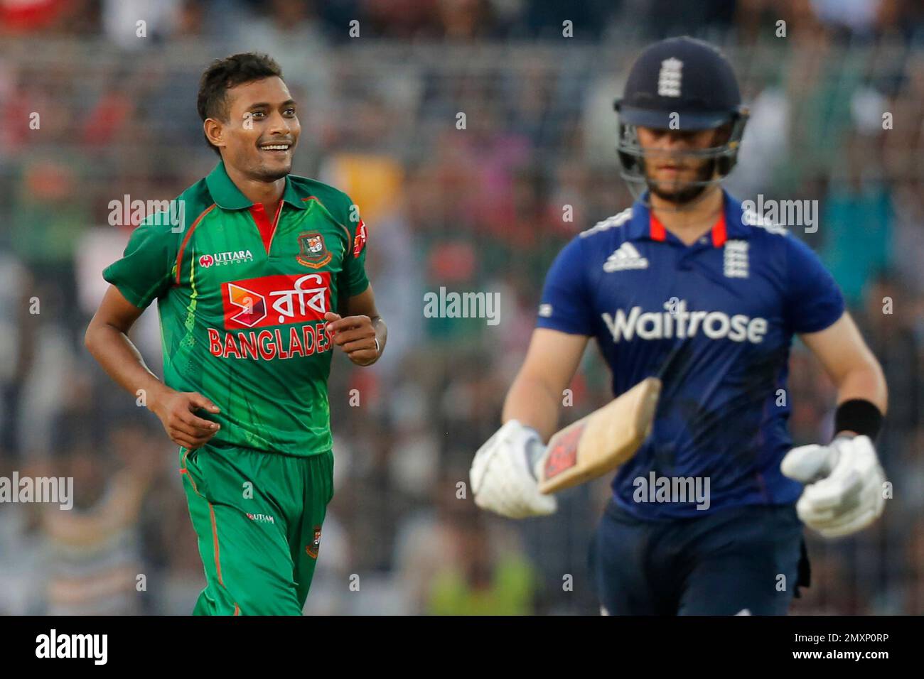 Bangladesh's Shafiul Islam, left, celebrates the dismissal of England’s ...