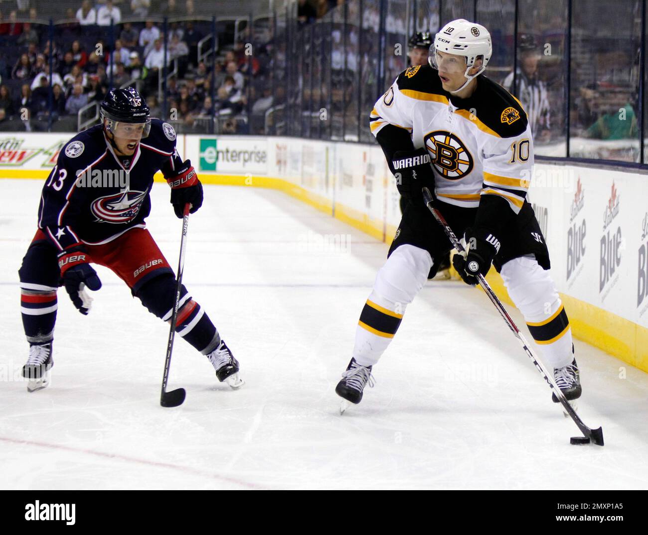 Boston Bruins defenseman Christian Ehrhoff, right, works against ...
