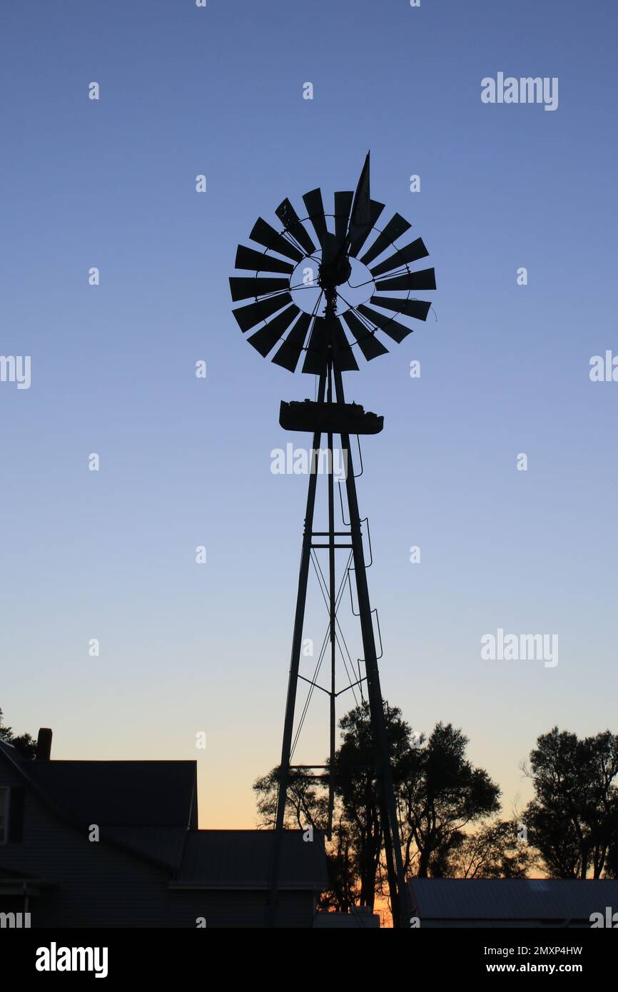 Kansas Sunset with a Windmill silhouette Stock Photo - Alamy