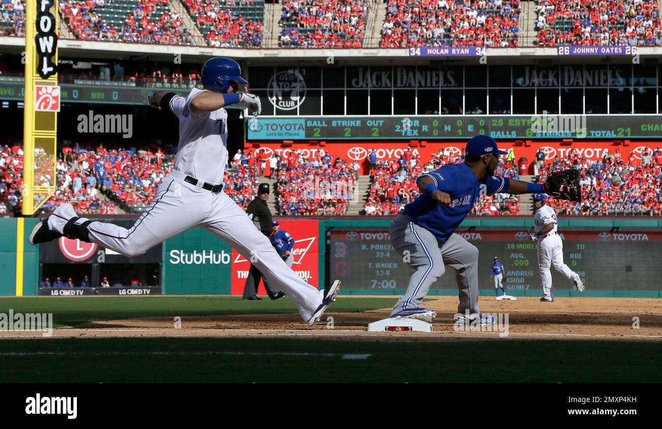 Texas Rangers' Mitch Moreland, left, is unable able to beat the throw ...