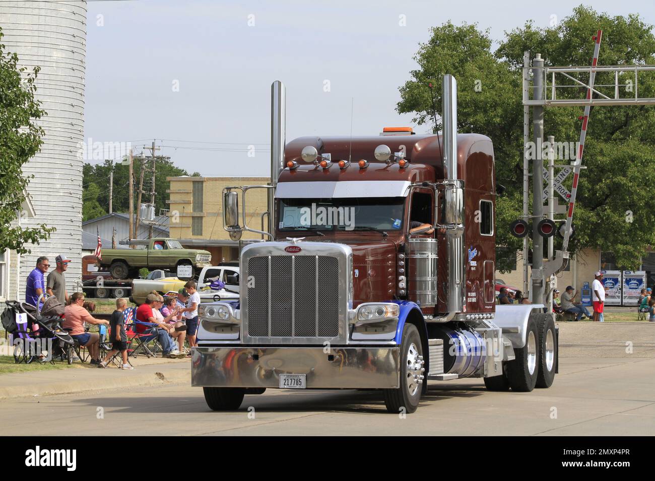 A PETERBILT Diesel Tractor in a parade with blue sky and trees Stock ...