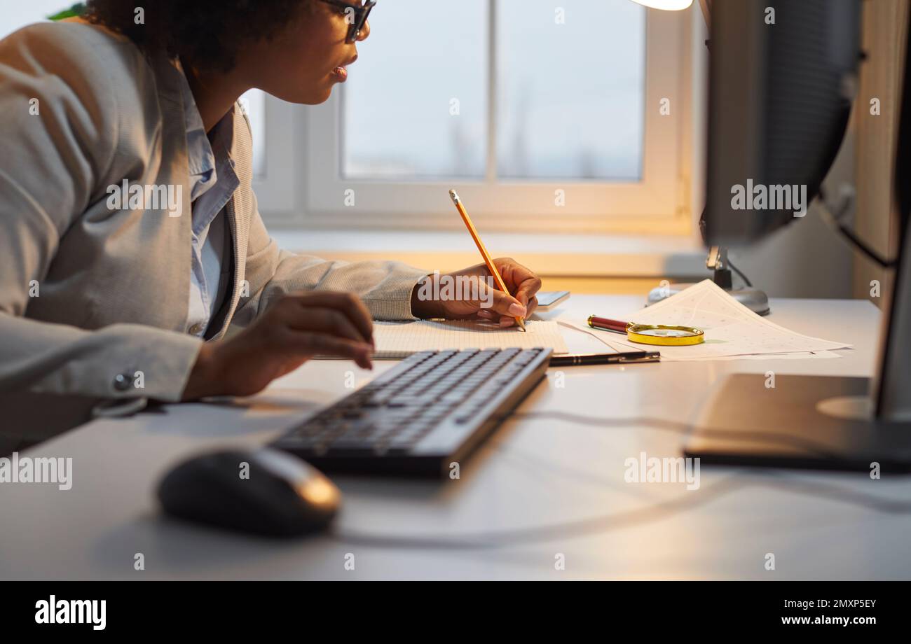 Woman auditor checking financial documents over office desk with ...