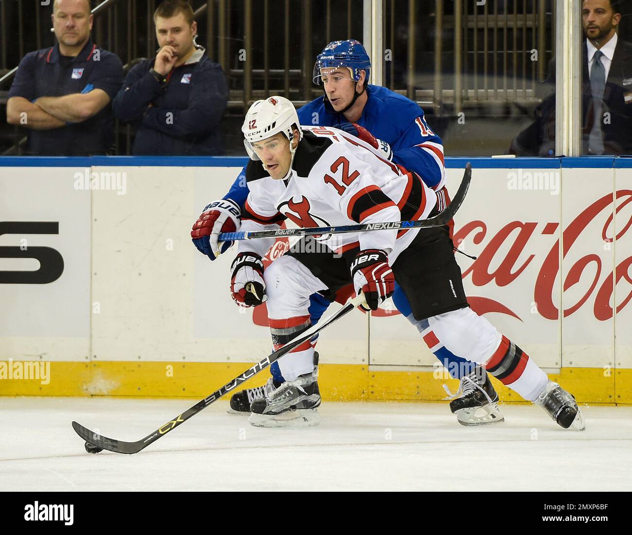 New Jersey Devils defenseman Ben Lovejoy (12) battles for the puck with ...