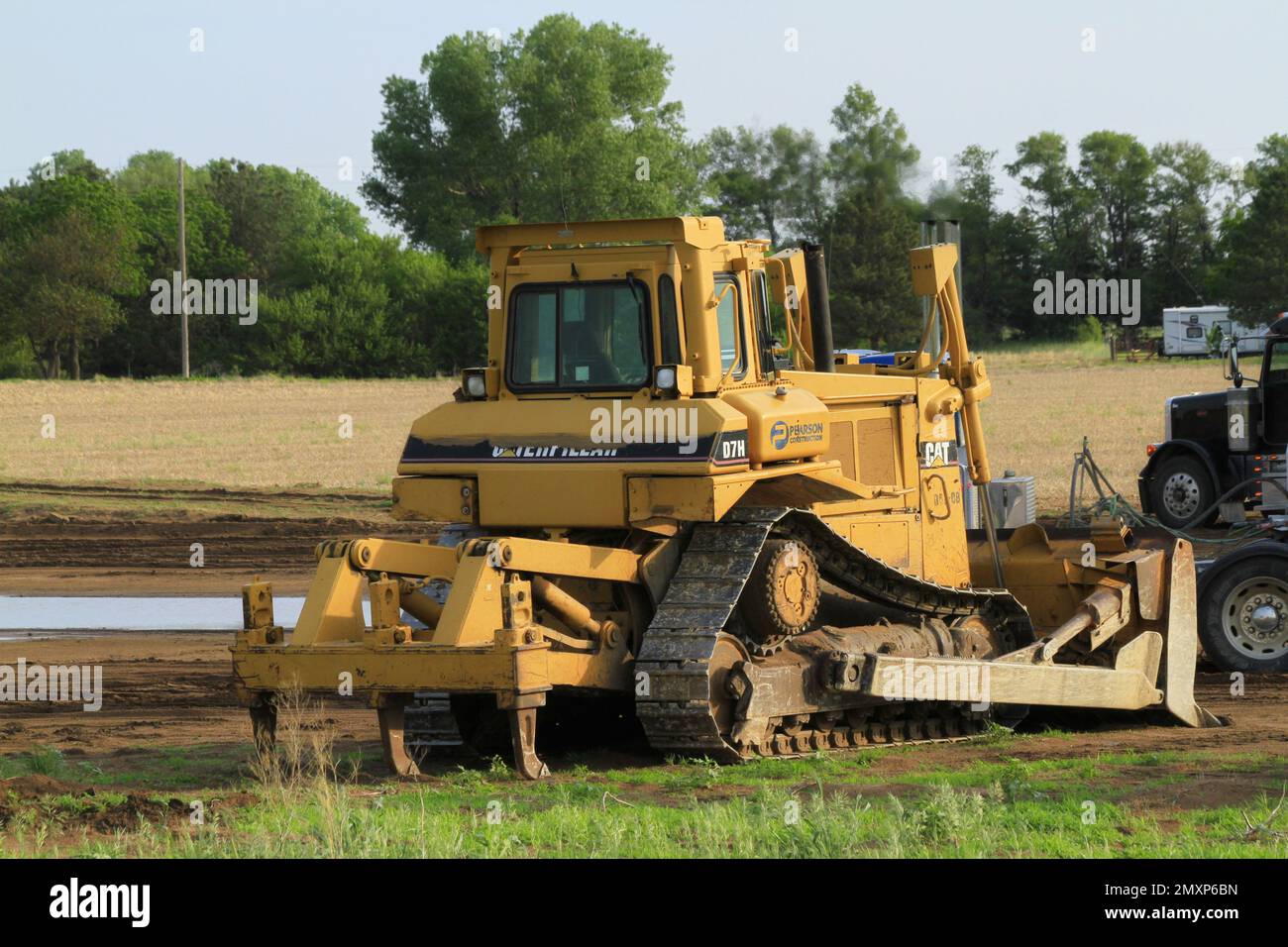 A caterpillar Bull Dozer at a work site with blue sky Stock Photo - Alamy