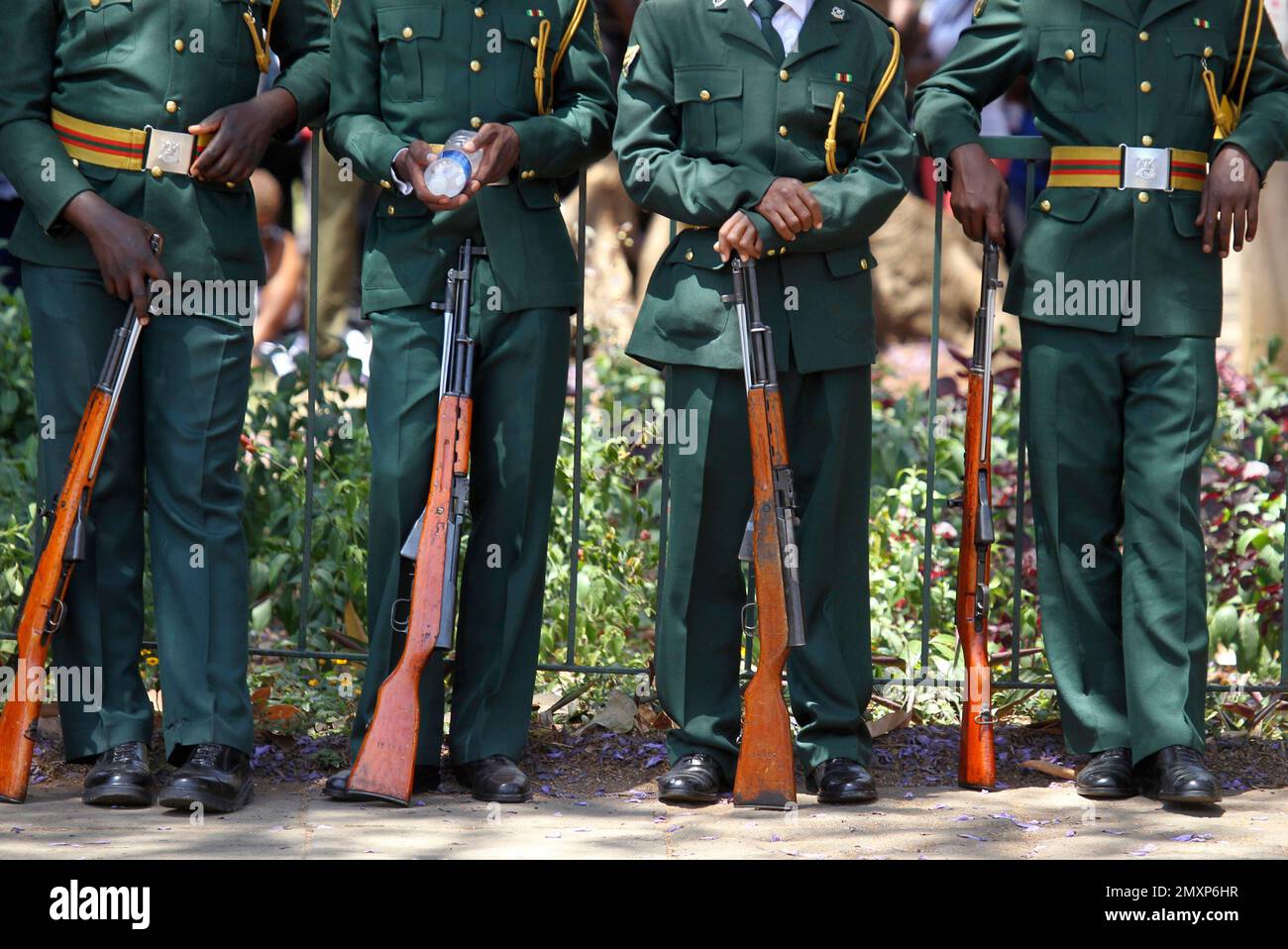 Zimbabwean soldiers relax during the opening of the 4th session of the ...