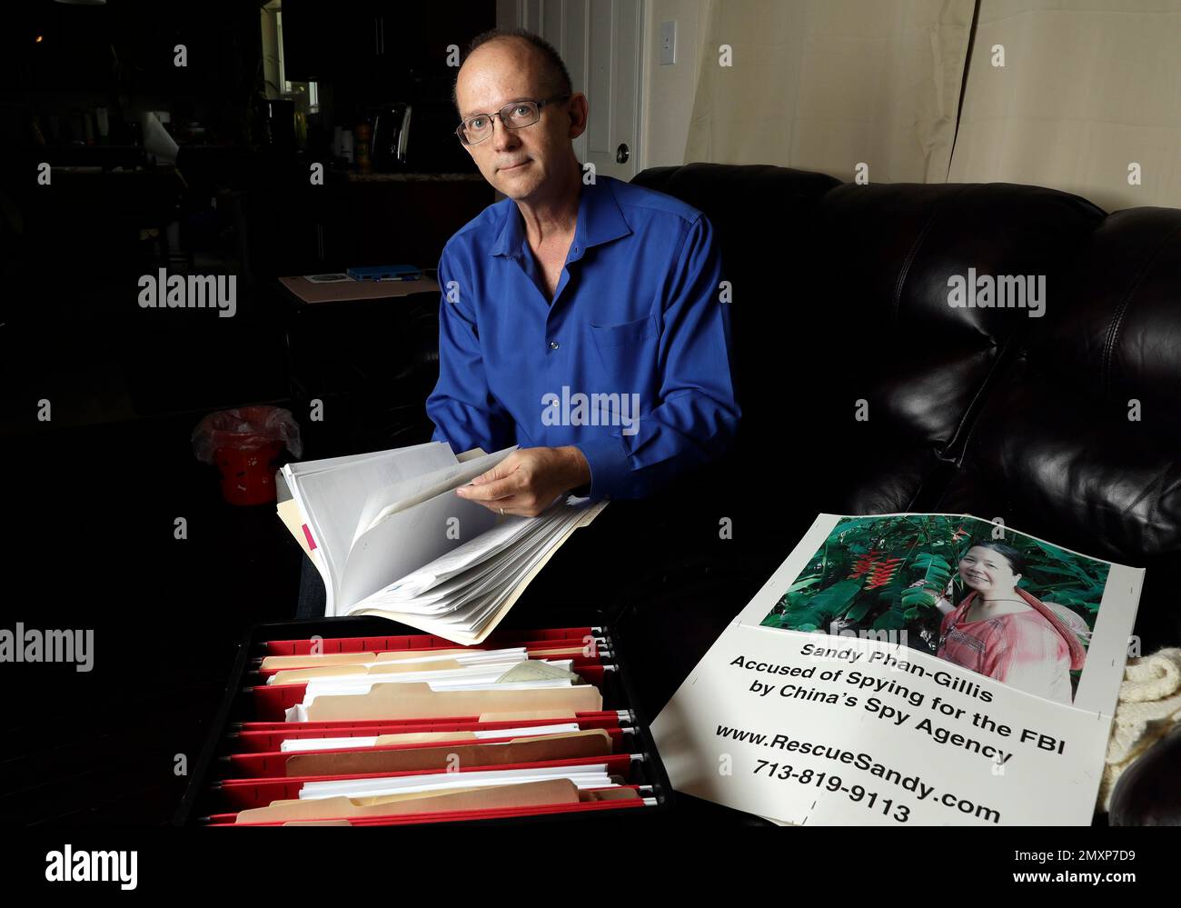In this Oct. 4, 2016, photo, Jeff Gillis looks through documents he has collected in support of ...