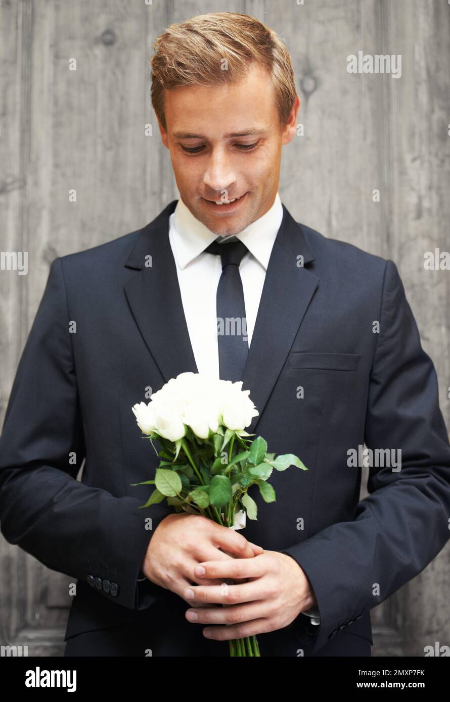 Young man waiting bunch flowers hi-res stock photography and images - Alamy