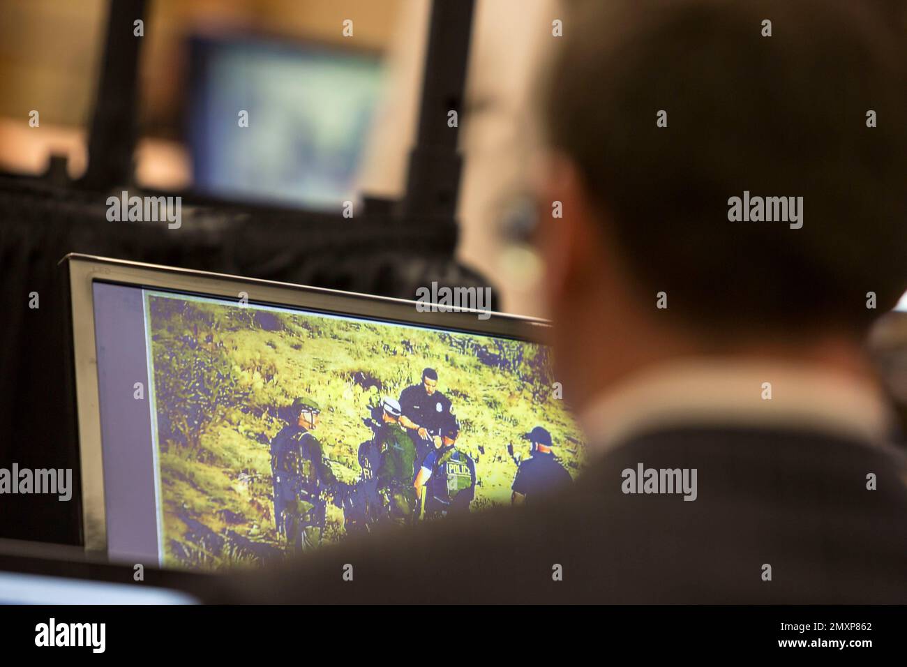 The prosecution reviews evidence submitted by the defense in the trial ...