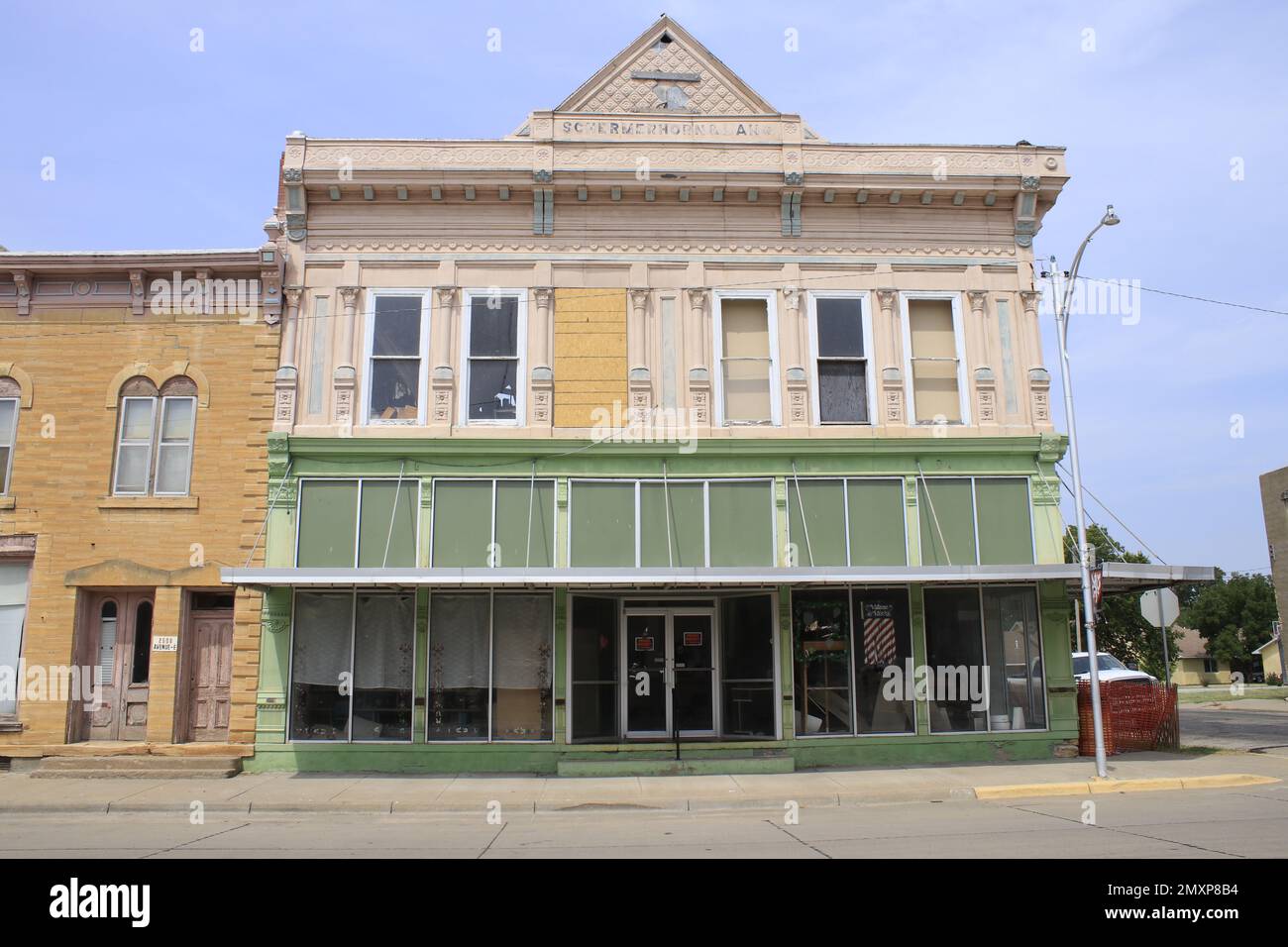 Old Buildings in Kansas with blue sky and store front windows of yester ...