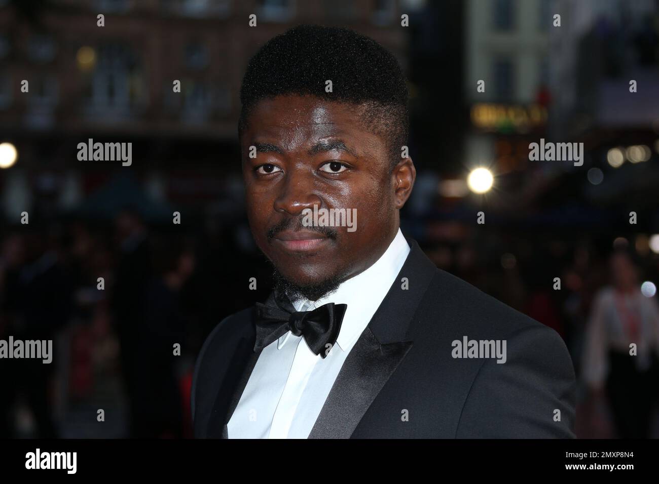 Actor Merveille Lukeba poses for photographers upon arrival at the ...