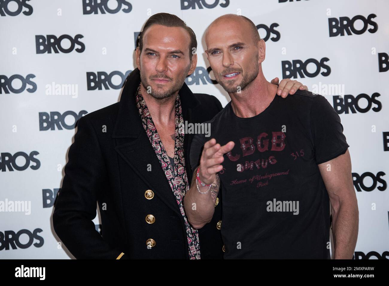Musicians Matt Goss and Luke Goss pose for photographers during a photo call after a press ...