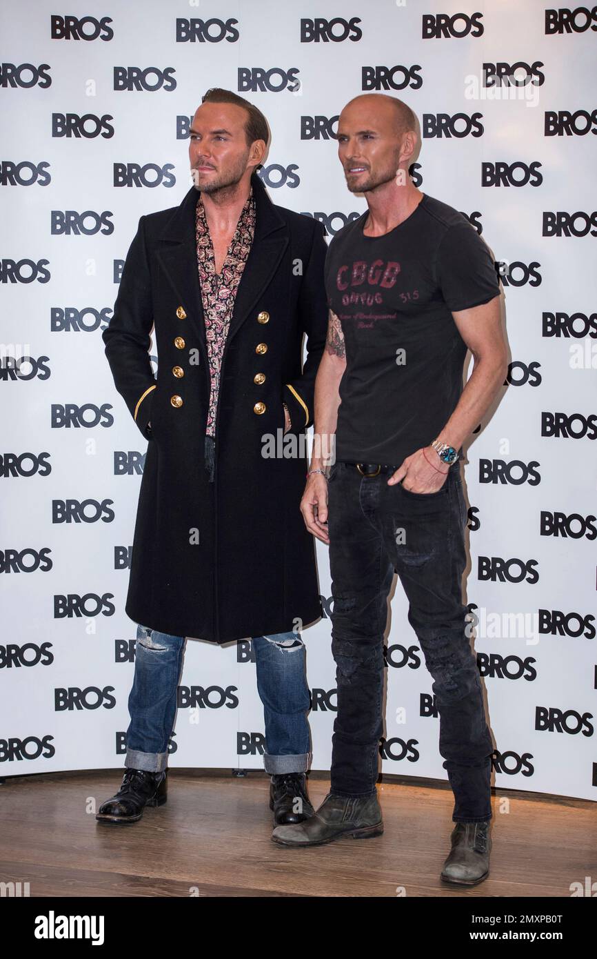 Musicians Matt Goss, left and Luke Goss pose for photographers during a ...